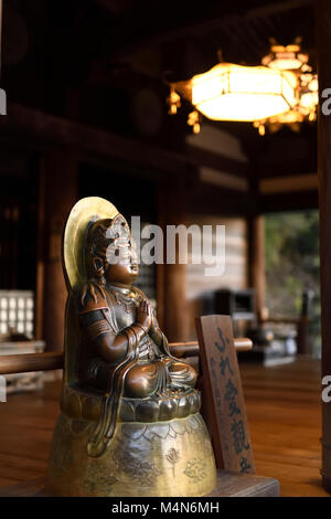 The statue of Kannon, the goddess of mercy in the Isshin-ji Temple of ...