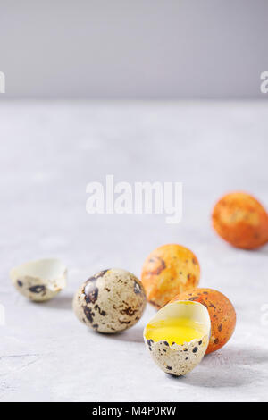 Easter greeting card with colorful eggs. Top view on stone table with ...