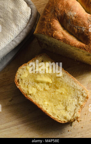 Melting butter on a slice of rustic toasted bread Stock Photo - Alamy