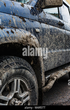 Side view of a very dirty car. Fragment of a dirty SUV. Dirty ...