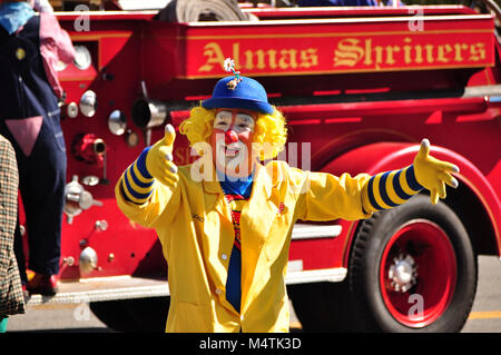 Clowns in Parade with fire engine Stock Photo - Alamy
