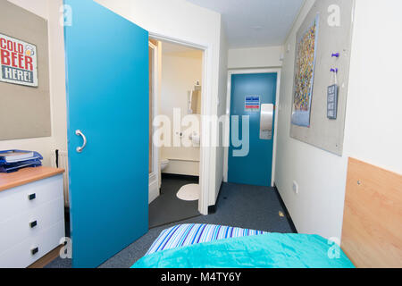 Small bedroom and study student accommodation area in university halls ...