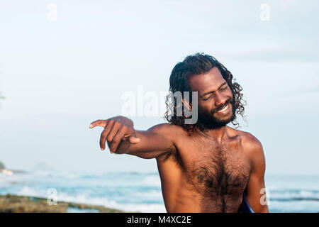 Shaka hand gesture. Dark-skinned male showing thumb and pinky raised in ...