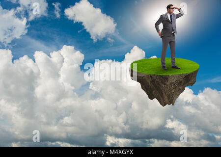 The businessman on flying island looking into future Stock Photo - Alamy
