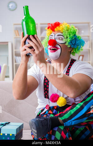 The drunk clown celebrating having a party at home Stock Photo - Alamy