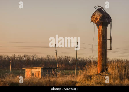 Rusty water tower. An old rustic communal communication Stock Photo - Alamy