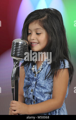 Little Girl Singer Stock Photo - Alamy