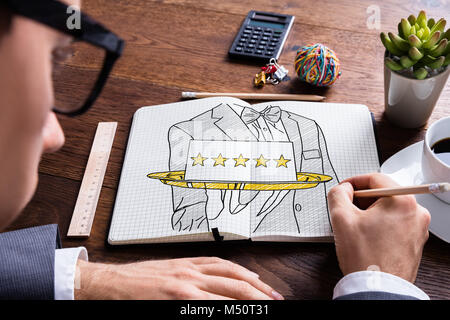 Man Drawing Hospitality Service Concept In Notepad Stock Photo - Alamy