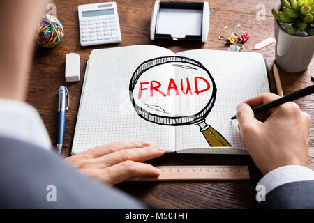 Man Drawing Fraud Investigation And Audit Stock Photo - Alamy