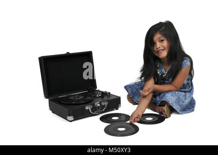 Little girl with vinyl 45 record and player Stock Photo - Alamy