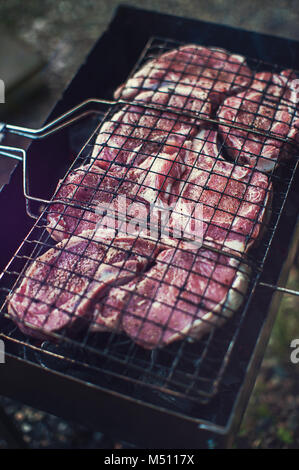 Grilling fresh entrecote pork Stock Photo - Alamy