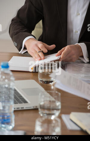 Business and finance concept. The man is leafing through the stickers ...