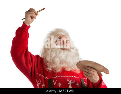 Portrait of Santa Claus painting with brush and palette isolated on ...