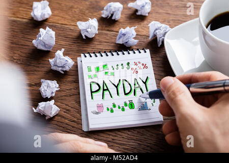 Payday Word In Notebook Stock Photo - Alamy