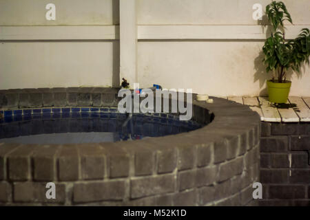 Outdoor Stone jacuzzi in Hotel room Stock Photo - Alamy