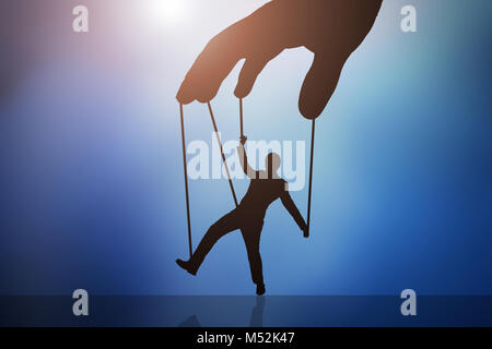 Close-up Of Person's Hand Controlling Puppet Against Gray Background ...