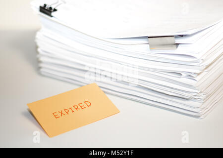 Expired Stack of Documents on white desk and Background Stock Photo - Alamy