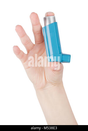 A person holds a Metered-Dose Inhaler above a cup containing a dark ...