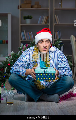 The man celebrating christmas at home alone Stock Photo - Alamy