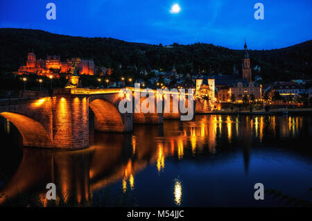 Heidelberg city night view with reflections along the neckar river ...