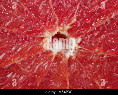 grapefruit bright red and cut by segments Stock Photo - Alamy