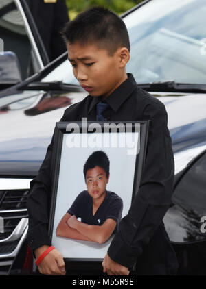 Parkland, Florida, USA. 18th Jan, 2018. Family members hold up Peter ...