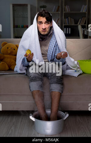 Sick man washing his feet at home Stock Photo - Alamy