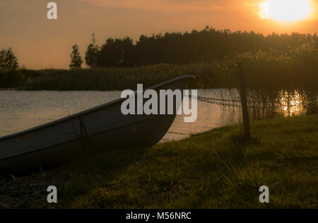 Old fisherman boat bayed on river Bullupe in Riga- Latvia. from the ...