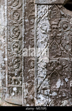 Bas-reliefs on walls of Ta Prohm jungle temple in Angkor, Cambodia ...