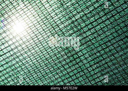 Green net texture with sun shining through Stock Photo - Alamy