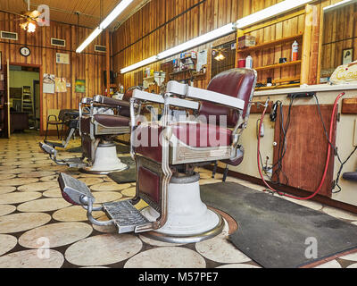 Empty chair in barber shop Stock Photo - Alamy