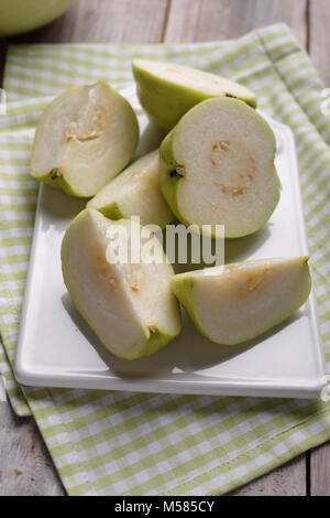 Guava fruits on a rustic table Stock Photo - Alamy