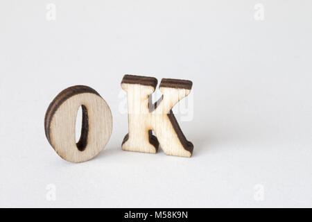 Word Okay made of wooden letters on crumpled paper, top view Stock ...