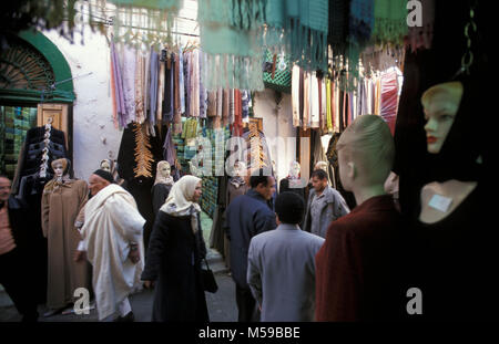 Libya Tripoli people shopping in shops set behind arcades framed with ...