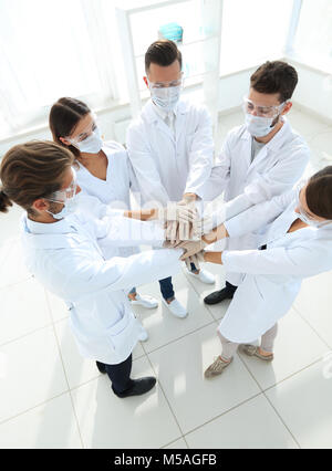 Health care workers demonstrating unity Stock Photo - Alamy
