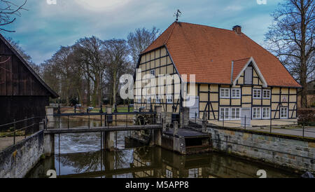 palace garden of water castle Rheda with watermill at river Ems ...