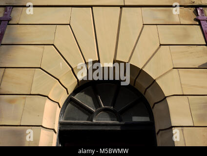 Stone arch door surround, Channelled rustication, ashlar and fanlight ...