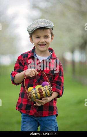 Happy siblings sharing playground basket swing in sunny park Stock ...