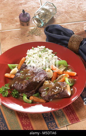 Tasty beef short ribs with vegetables on plate, closeup Stock Photo - Alamy