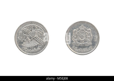 A closeup of half a Moroccan Dirham coin on a brown table Stock Photo ...