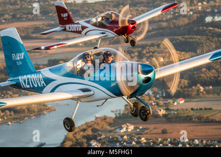 Two Vans RV-12 light sport aircrafts fly in formation together over the ...