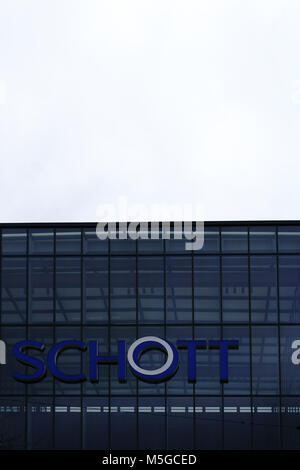 The glass facade of Schott AG headquarters in Mainz with tinted windows ...