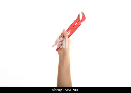 Hand holding a white metal pipe with more pipes in the background Stock ...