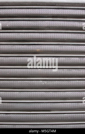 Perforated metal slats closeup texture background Stock Photo - Alamy