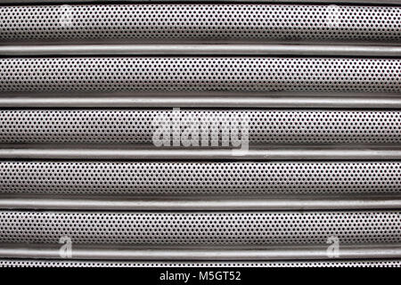 Perforated metal slats closeup texture background Stock Photo - Alamy