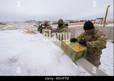 An 890th Missile Security Forces Squadron security forces member reloads his M249 machine gun ...