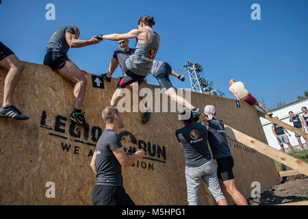 Teamwork to overcome obstacle Stock Photo: 87079995 - Alamy