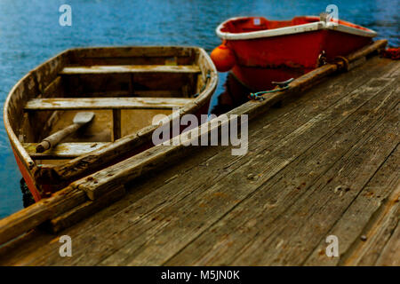 Two row boats moored at the dock on Lake O'Hara, Yoho National Park, British Columbia, Canada ...