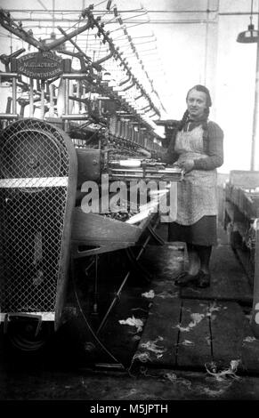 A woman works in a textile factory producing African wax prints in ...