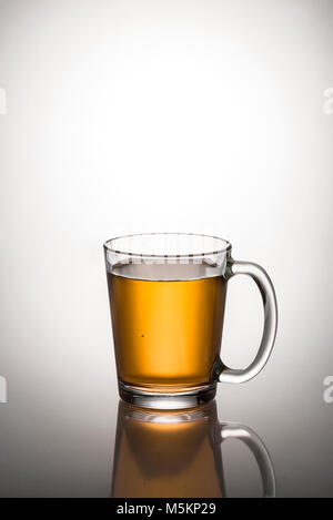 glass cup full of tea with tea-bag immersed, on white background Stock ...